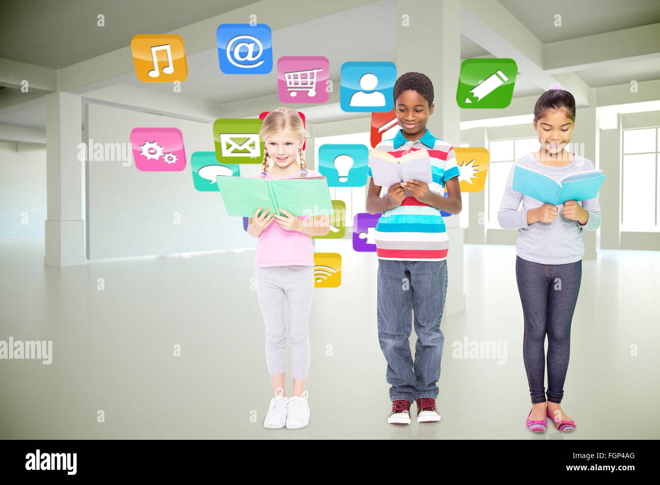 Composite image of elementary pupils reading Stock Photo - Alamy