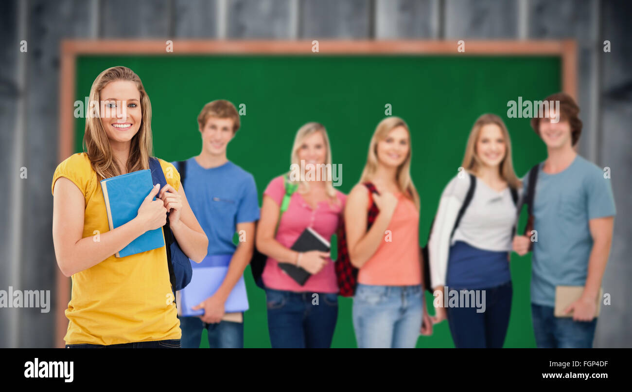 Composite image of a group of college students standing as one girl ...