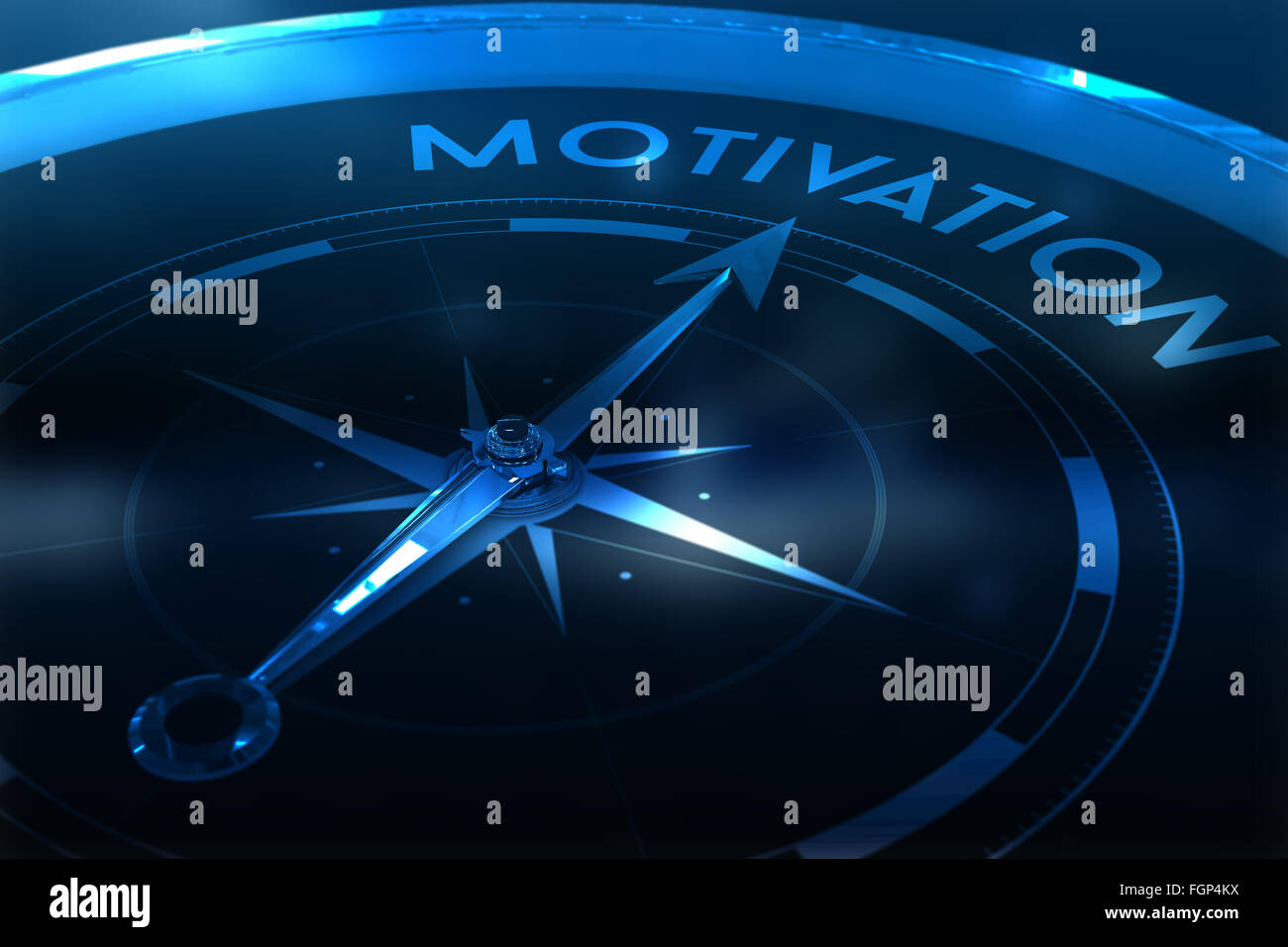 Composite image of compass pointing to motivation Stock Photo - Alamy