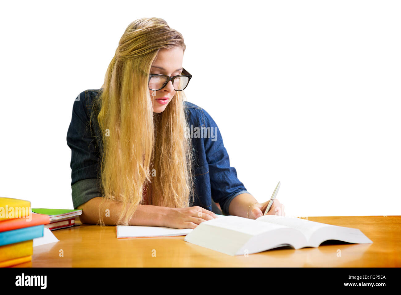 Composite image of student studying in the library Stock Photo - Alamy