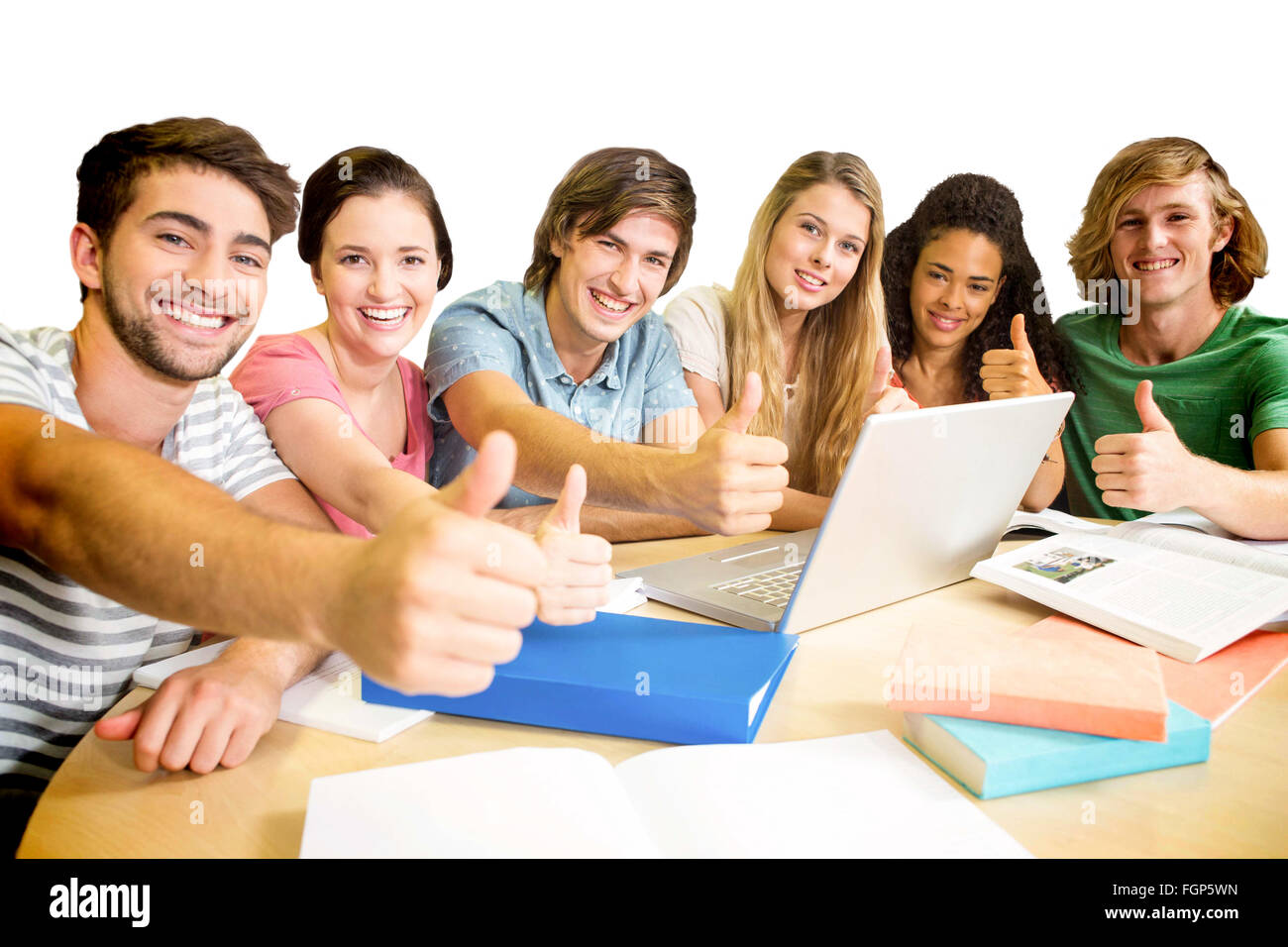 College students gesturing thumbs up in library Stock Photo - Alamy