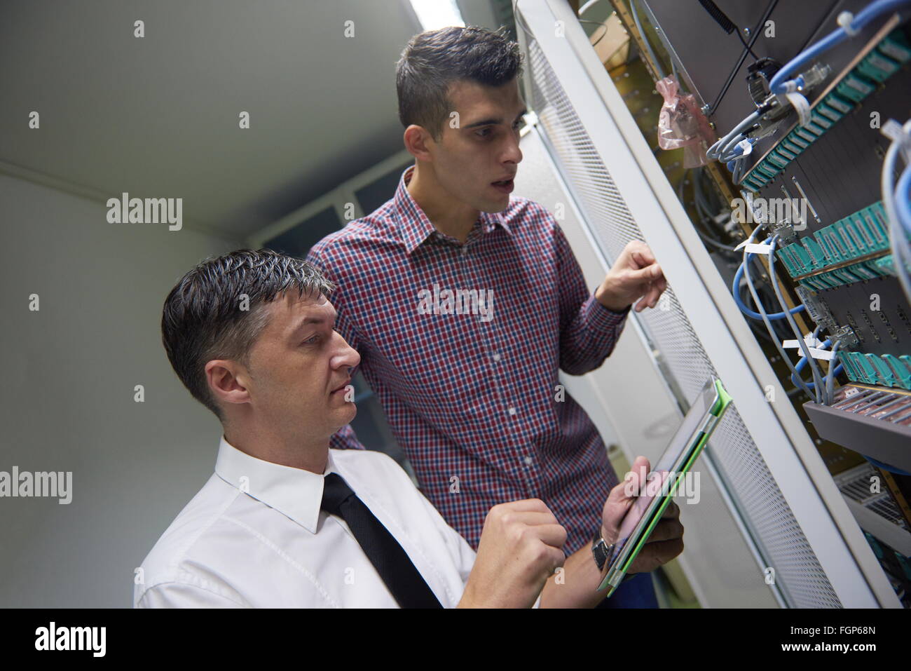 network engineers in server room Stock Photo - Alamy