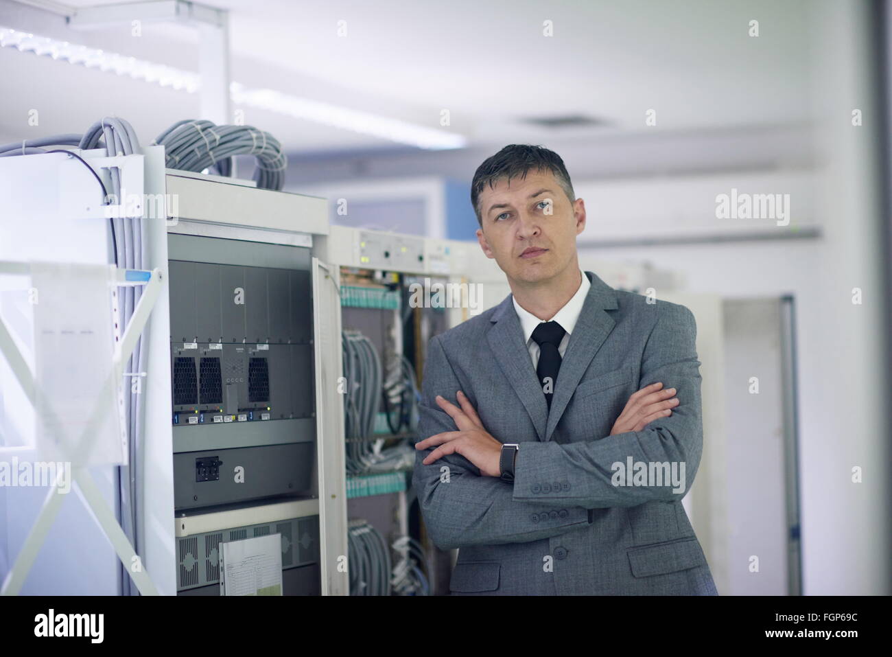 network engineer working in server room Stock Photo - Alamy