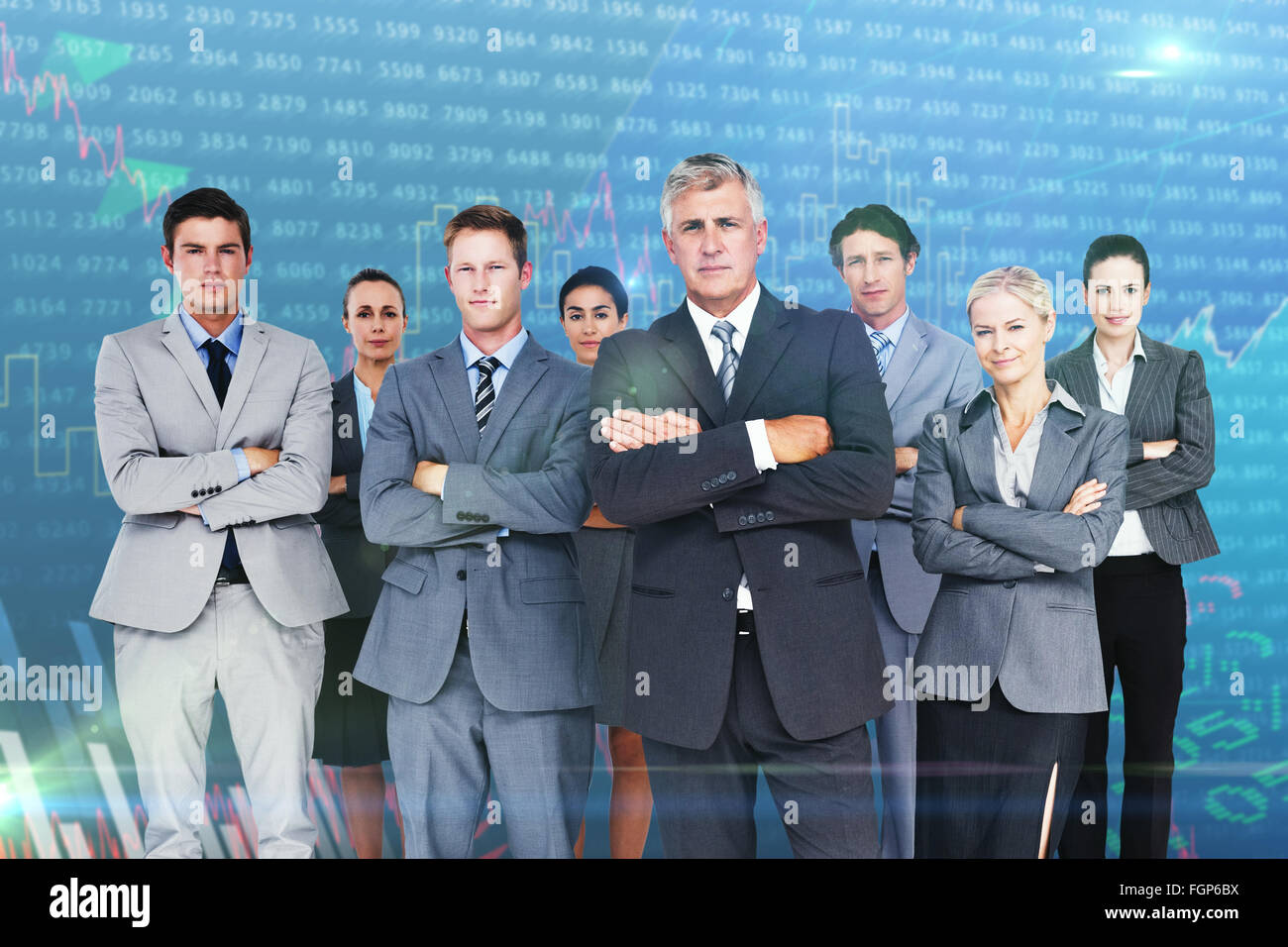 Composite image of business team standing arms crossed Stock Photo - Alamy
