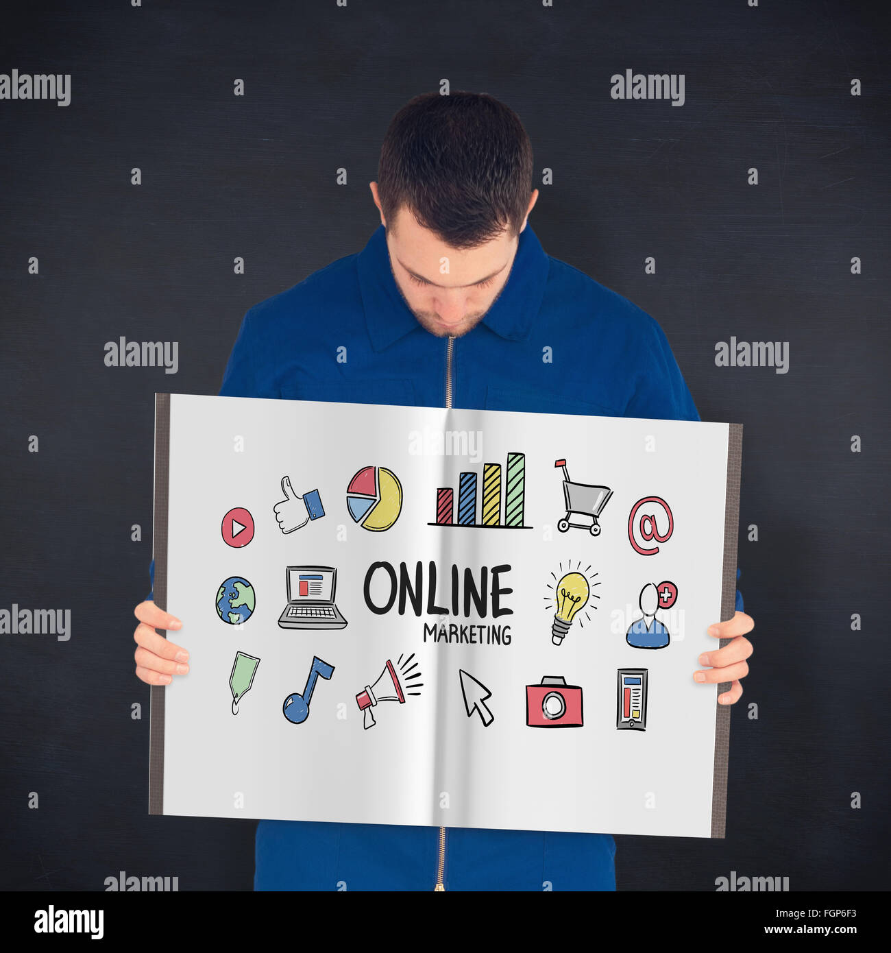 Composite image of manual worker showing a book Stock Photo - Alamy