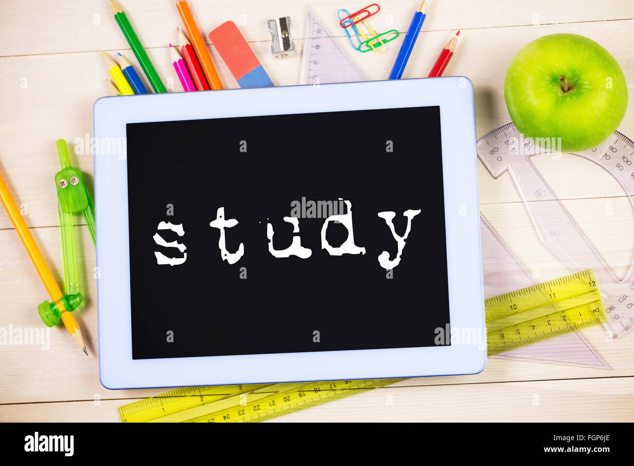 Study against students table with school supplies Stock Photo - Alamy
