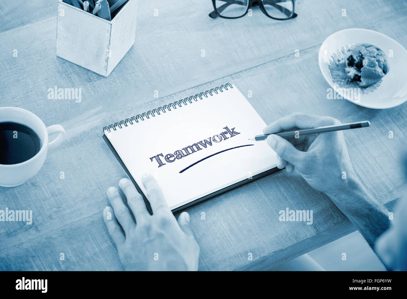 Testing against man writing notes on notebook Stock Photo - Alamy