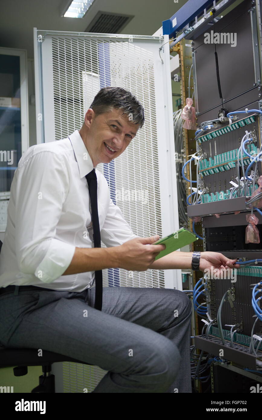 network engineer working in server room Stock Photo - Alamy