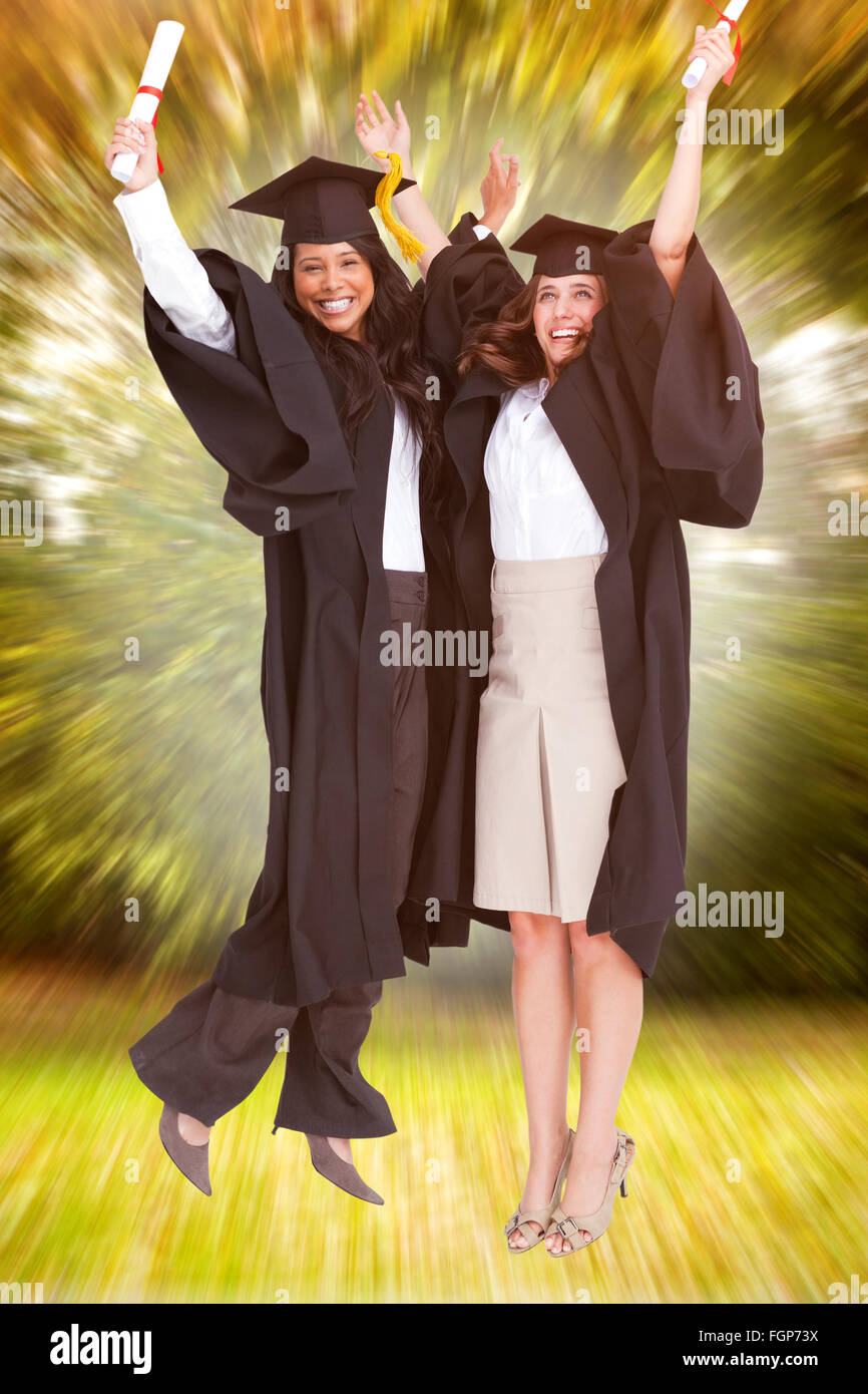 Composite image of full length of two women celebrating in the air ...