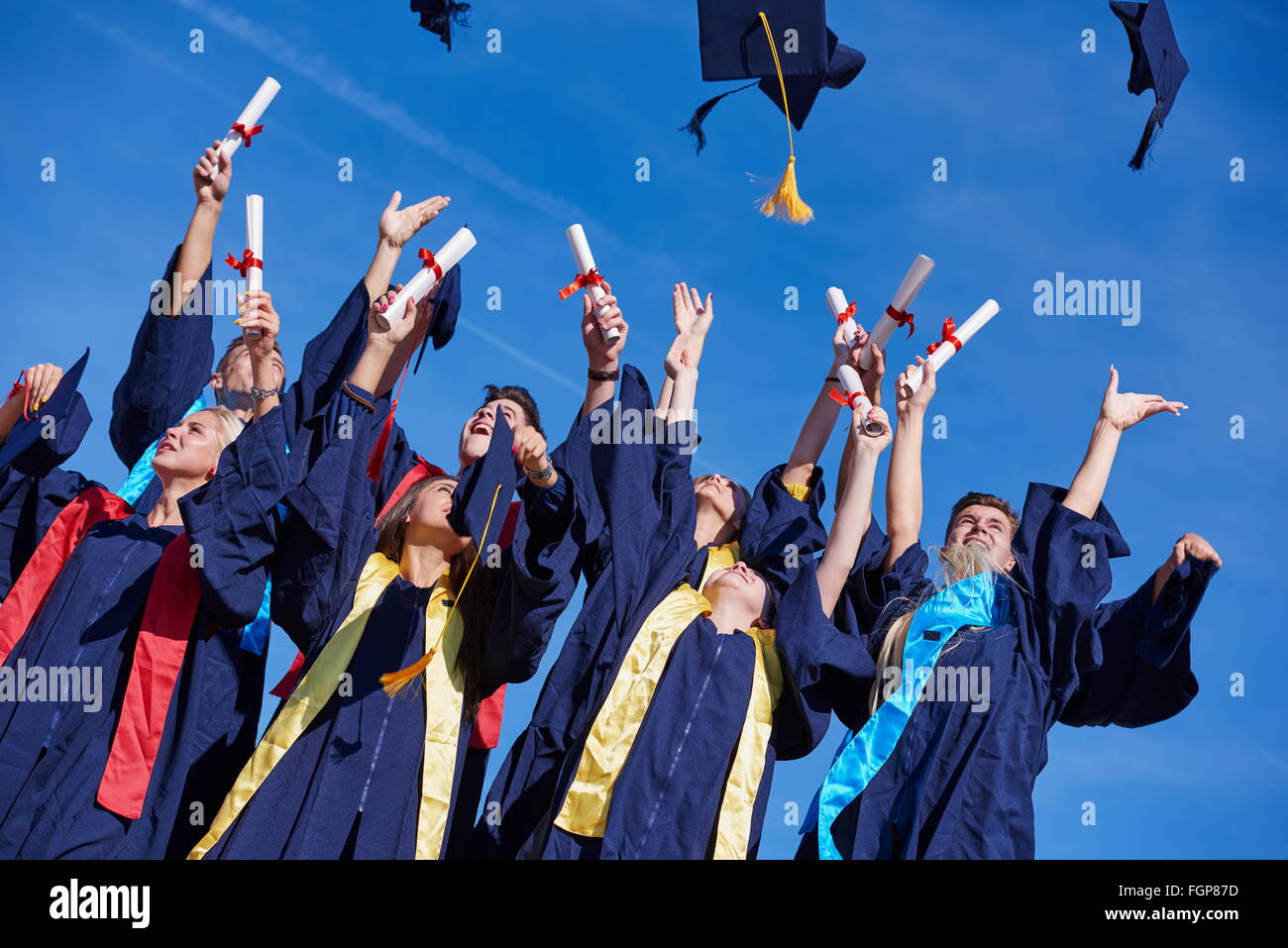 Group happy graduates throwing graduation hi-res stock photography and ...