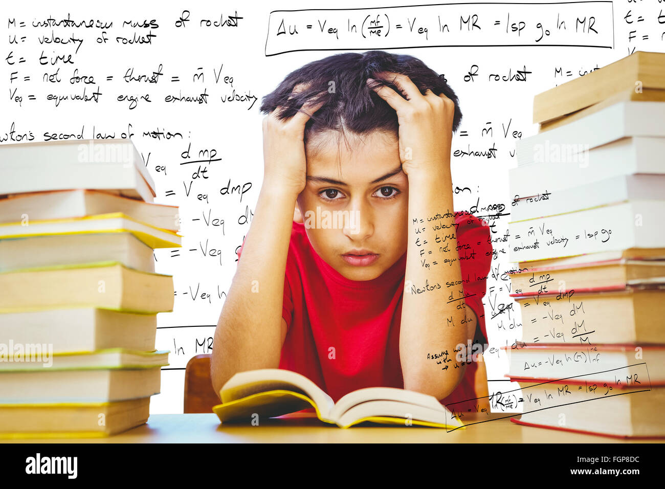 Composite image of tensed boy sitting with stack of books Stock Photo ...