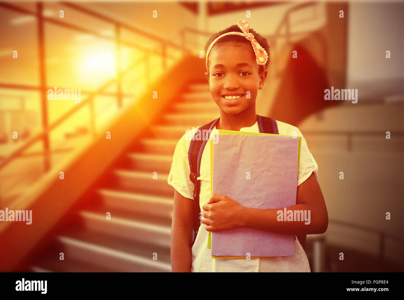 Composite image of little girl holding folders in school corridor Stock ...