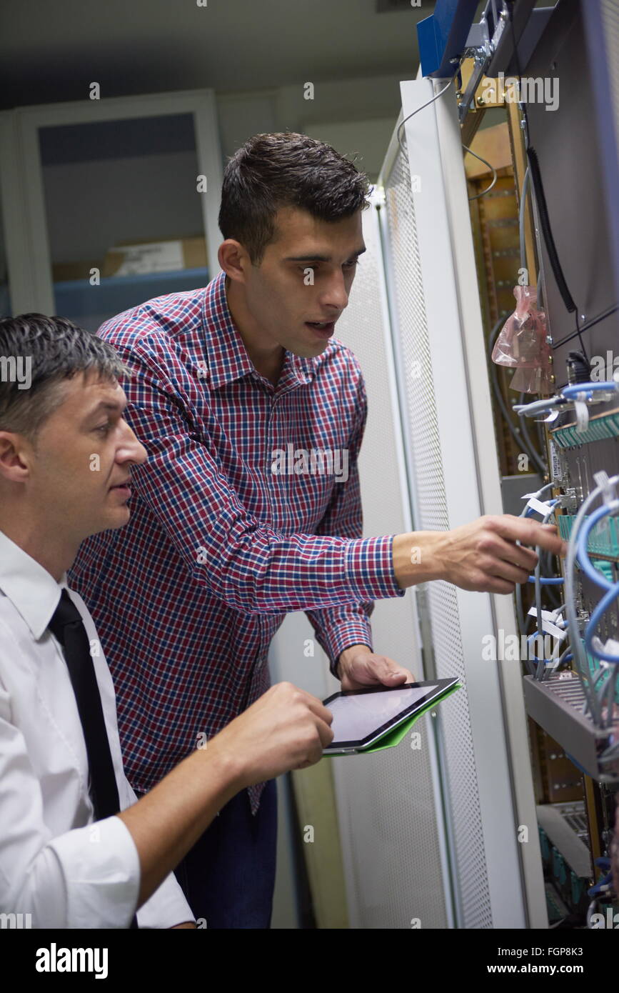 network engineers in server room Stock Photo - Alamy