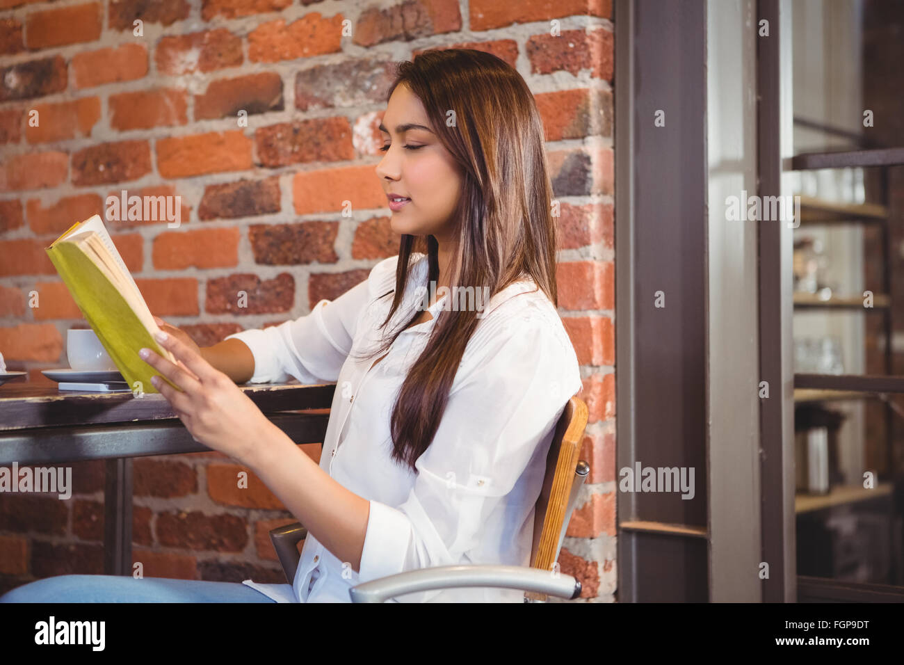 Beautiful businesswoman reading a book Stock Photo - Alamy