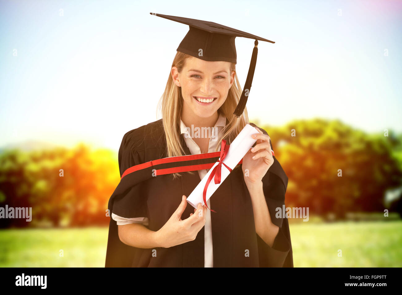 Composite image of woman smiling at her graduation Stock Photo - Alamy