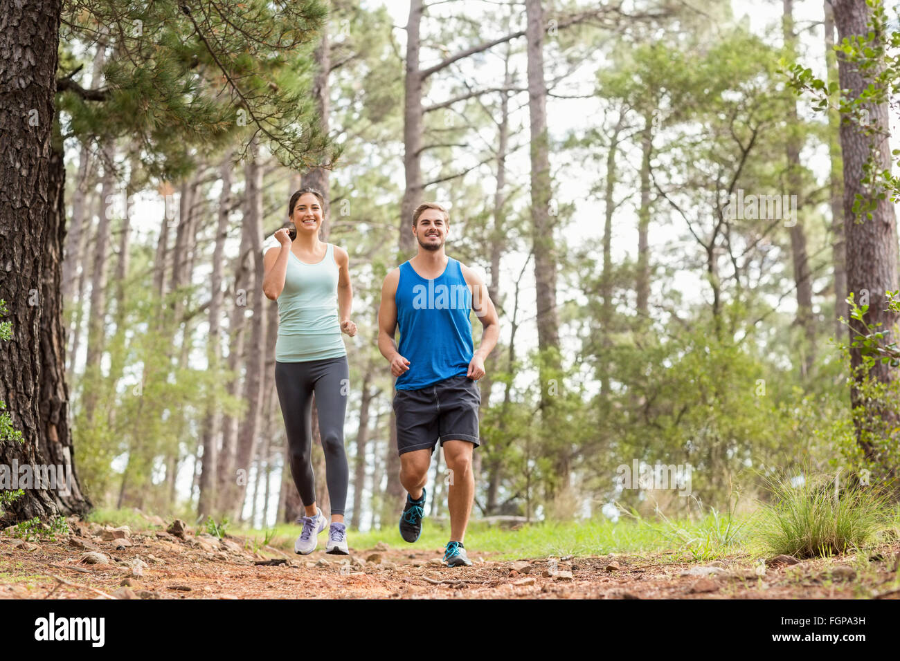 Happy joggers running Stock Photo - Alamy