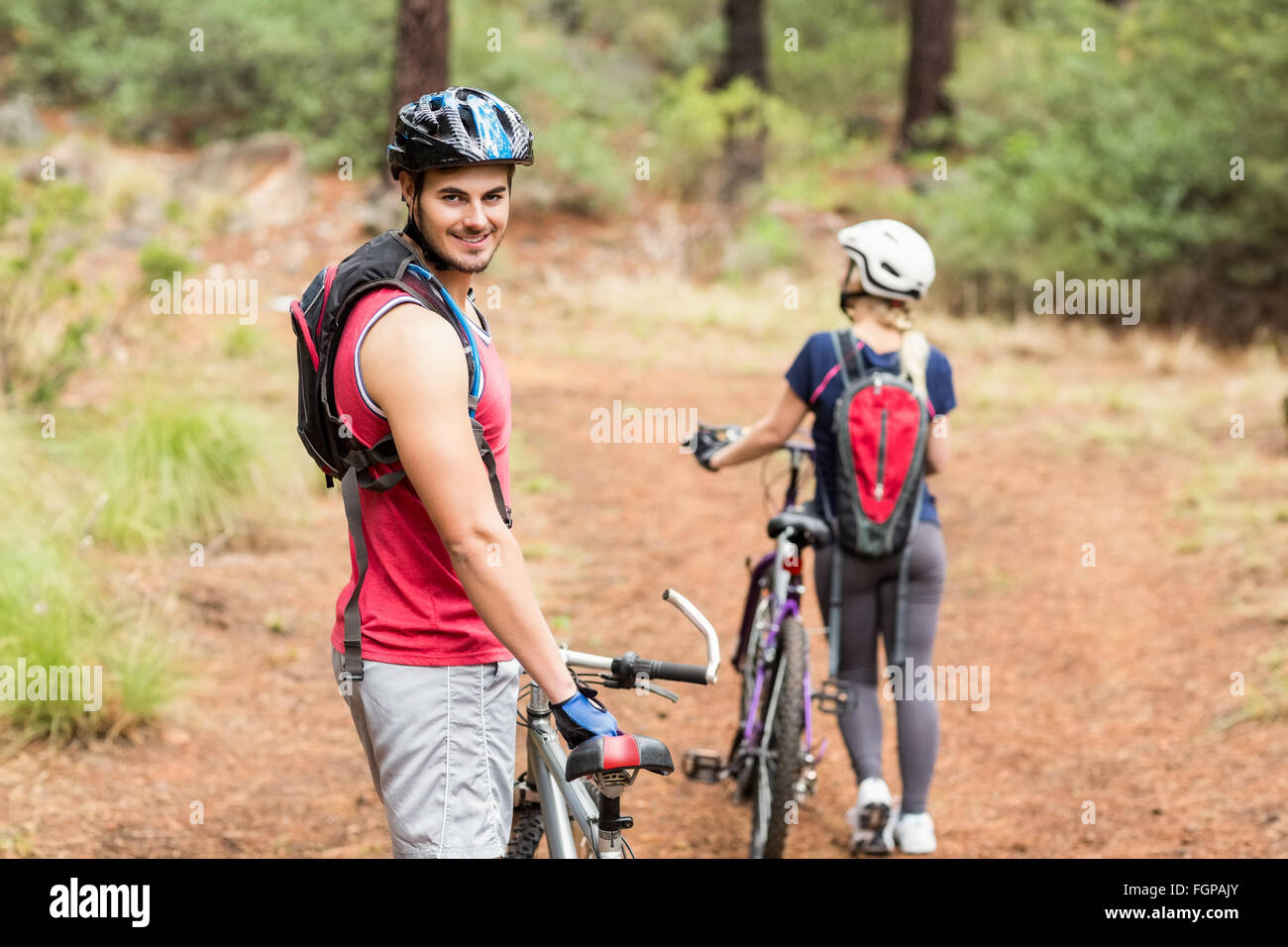 Handsome biker looking at the camera Stock Photo - Alamy