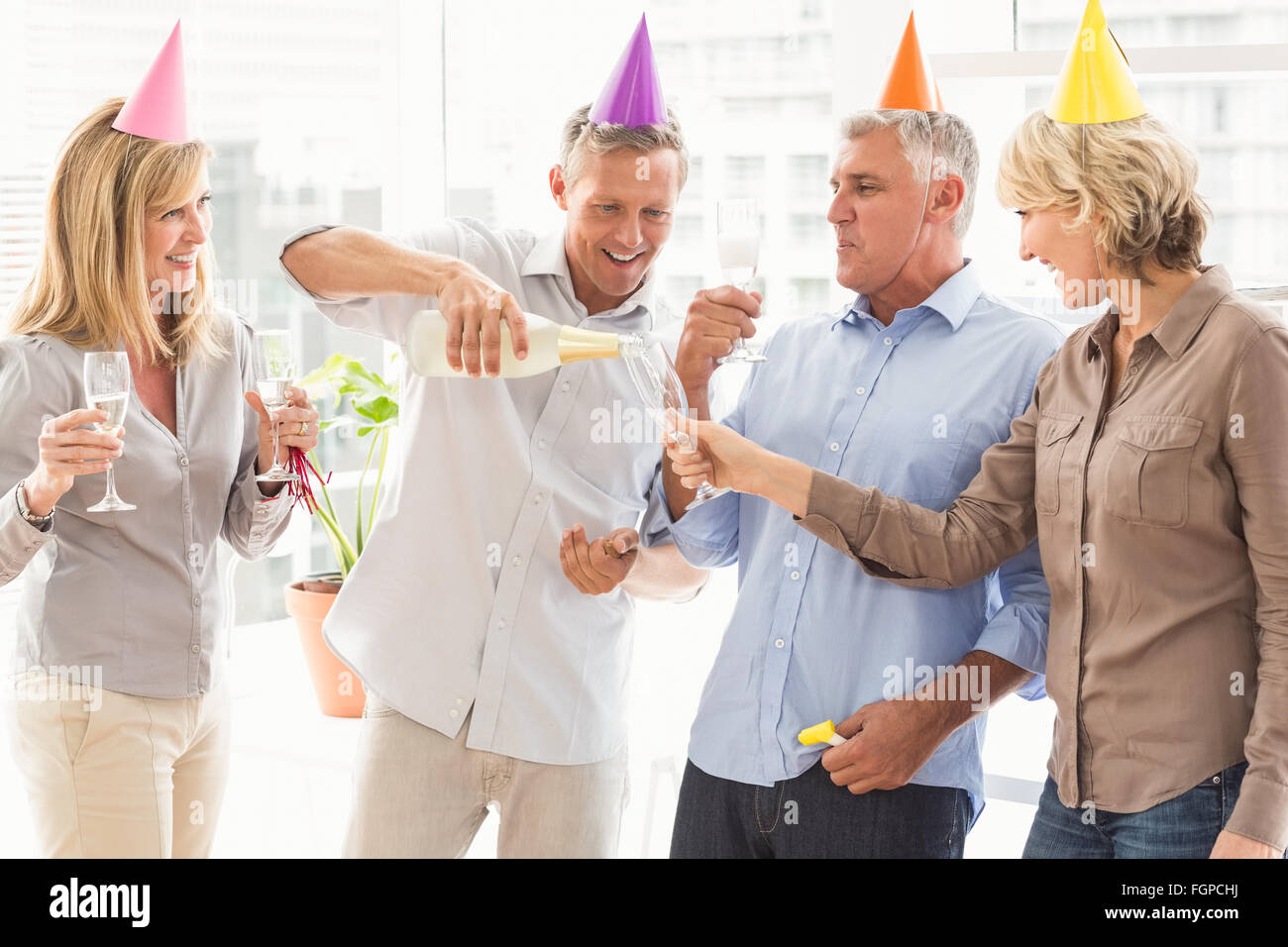 Casual business people making birthday toasts Stock Photo - Alamy