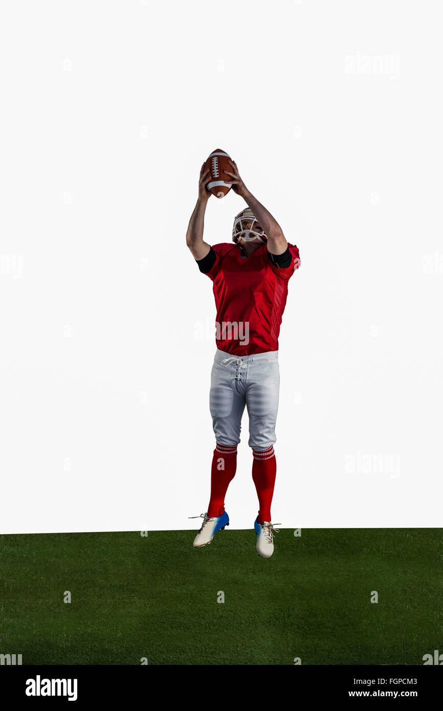 American football player catching football Stock Photo - Alamy