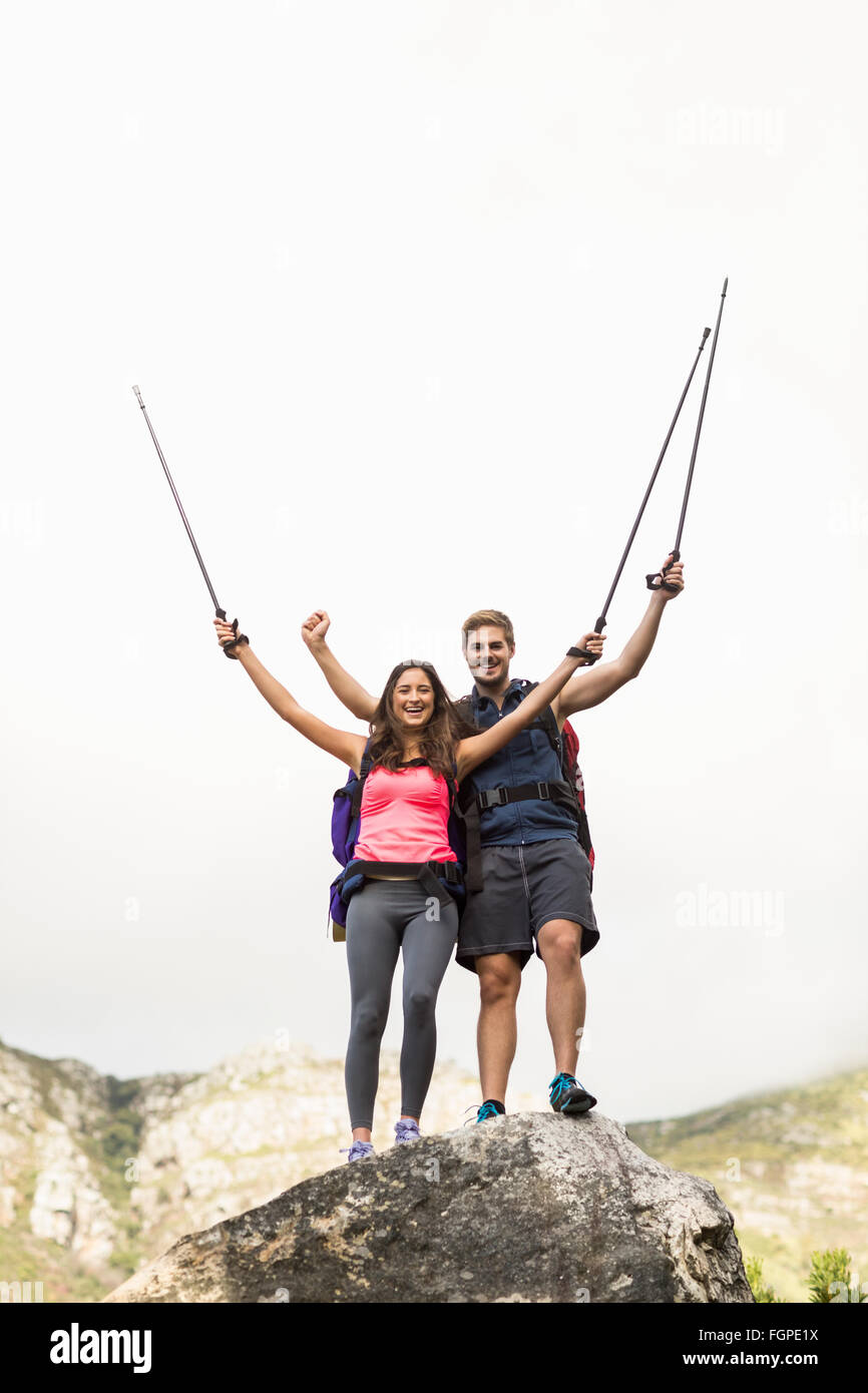 Young happy joggers standing on rock cheering Stock Photo - Alamy