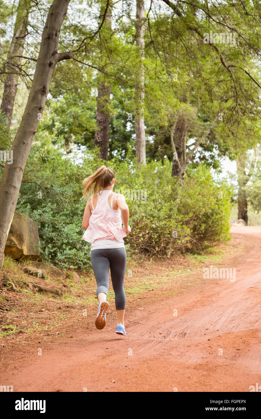 Pretty blonde athlete jogging Stock Photo - Alamy