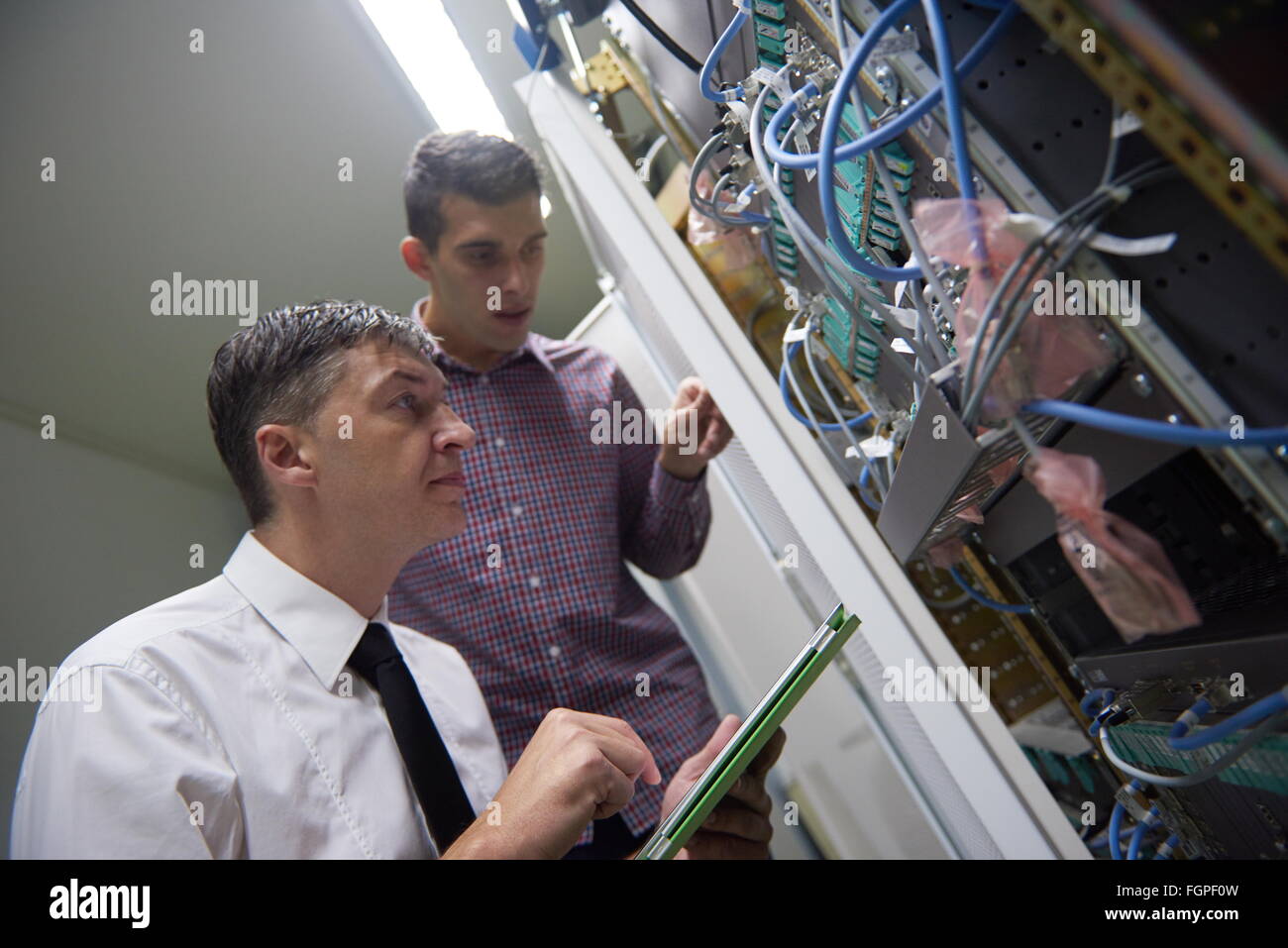 network engineers in server room Stock Photo - Alamy