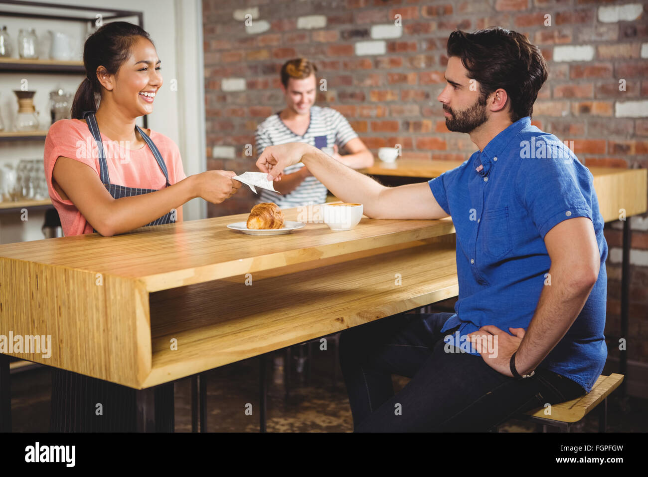 Young man taking his receipt Stock Photo - Alamy
