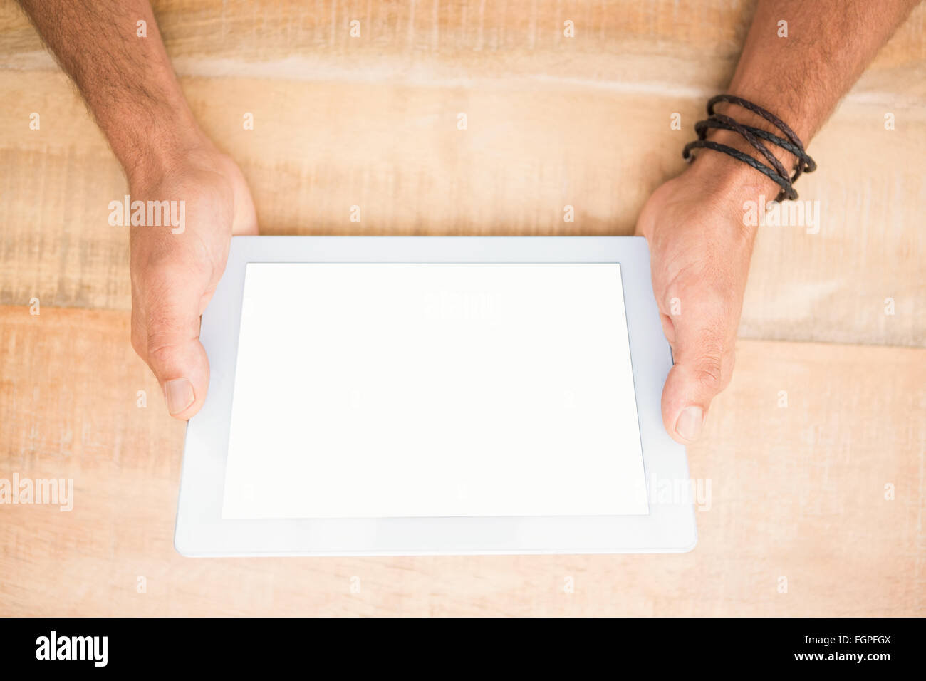 Hands holding blank screen tablet Stock Photo - Alamy