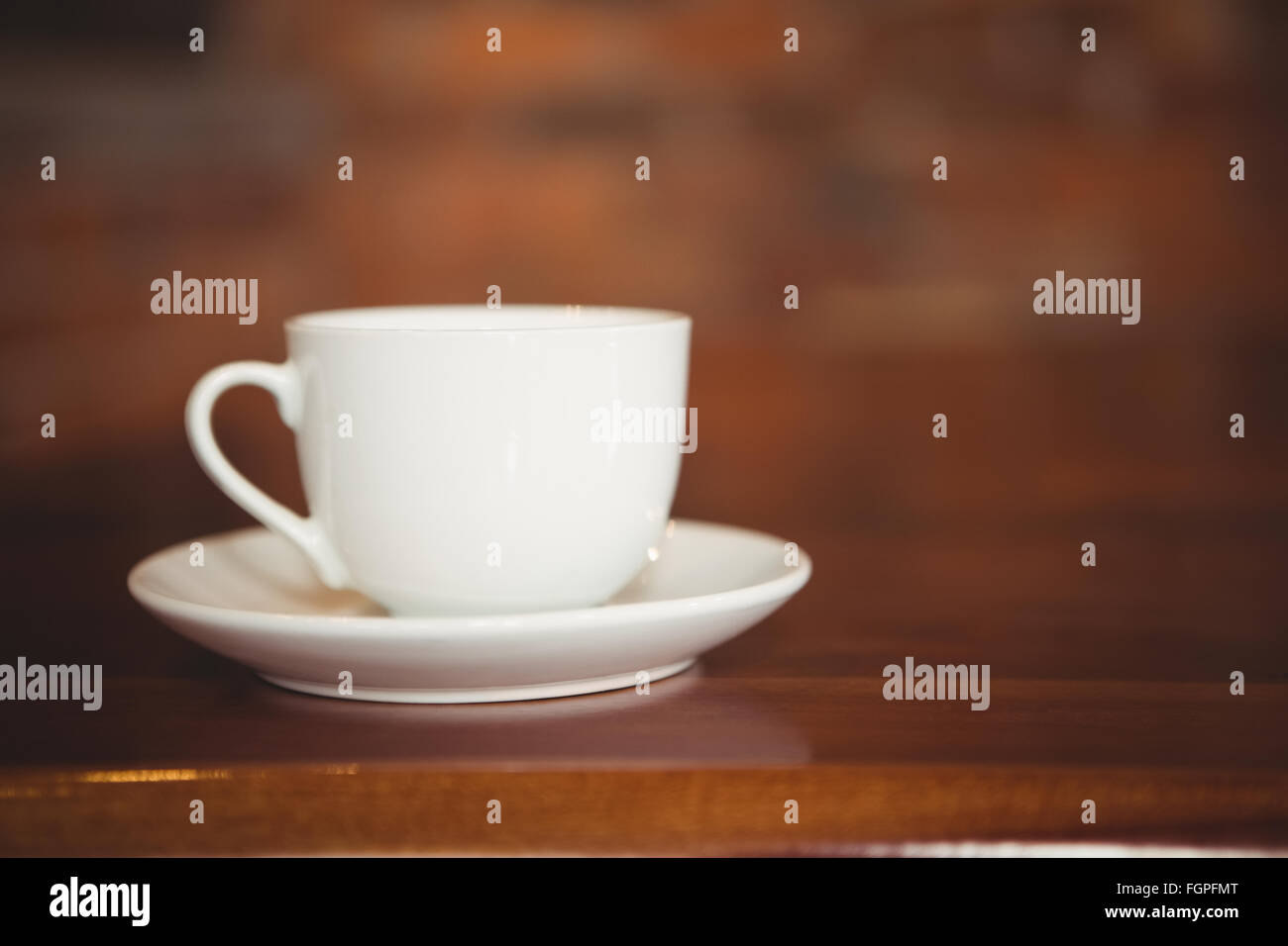 Cup and saucer on the counter Stock Photo - Alamy