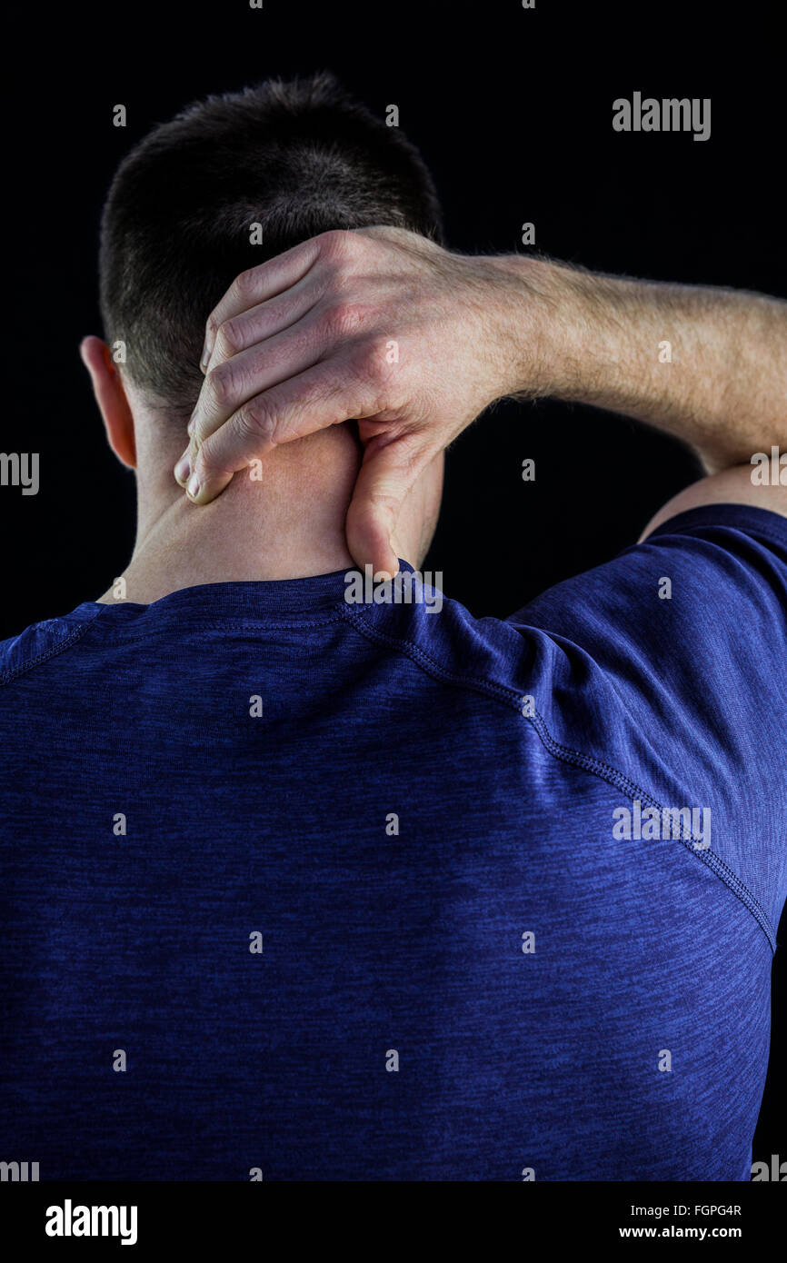 Rear view of a man with neck pain over Stock Photo - Alamy