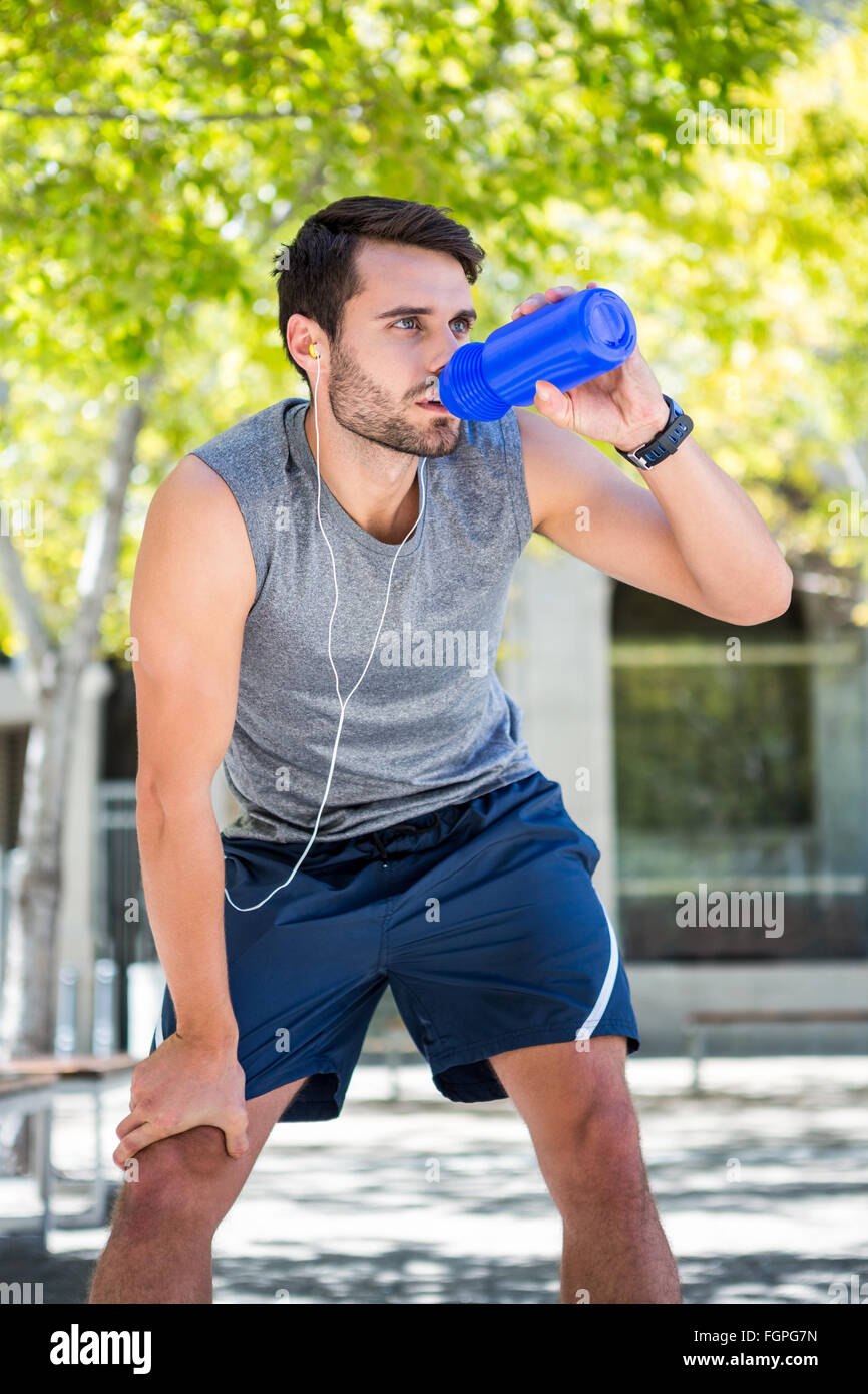 Handsome runner drinking fresh water Stock Photo - Alamy