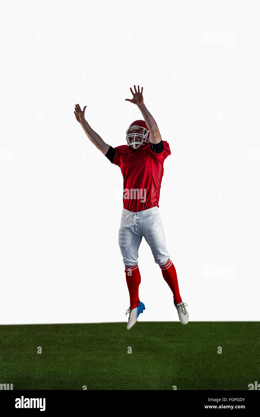 American football player trying to catch football Stock Photo - Alamy