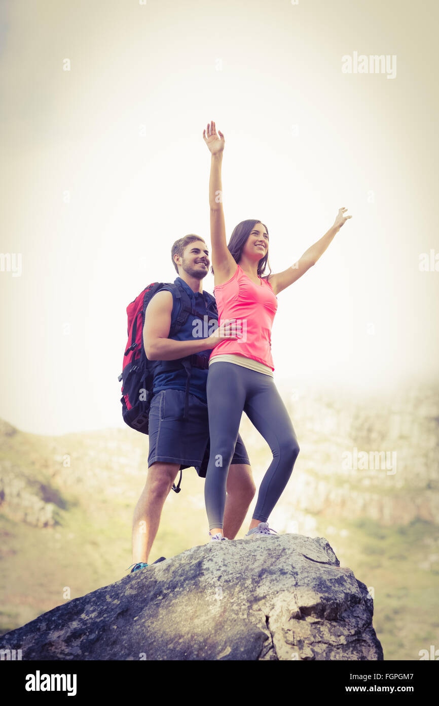 Young happy joggers posing on rock Stock Photo - Alamy