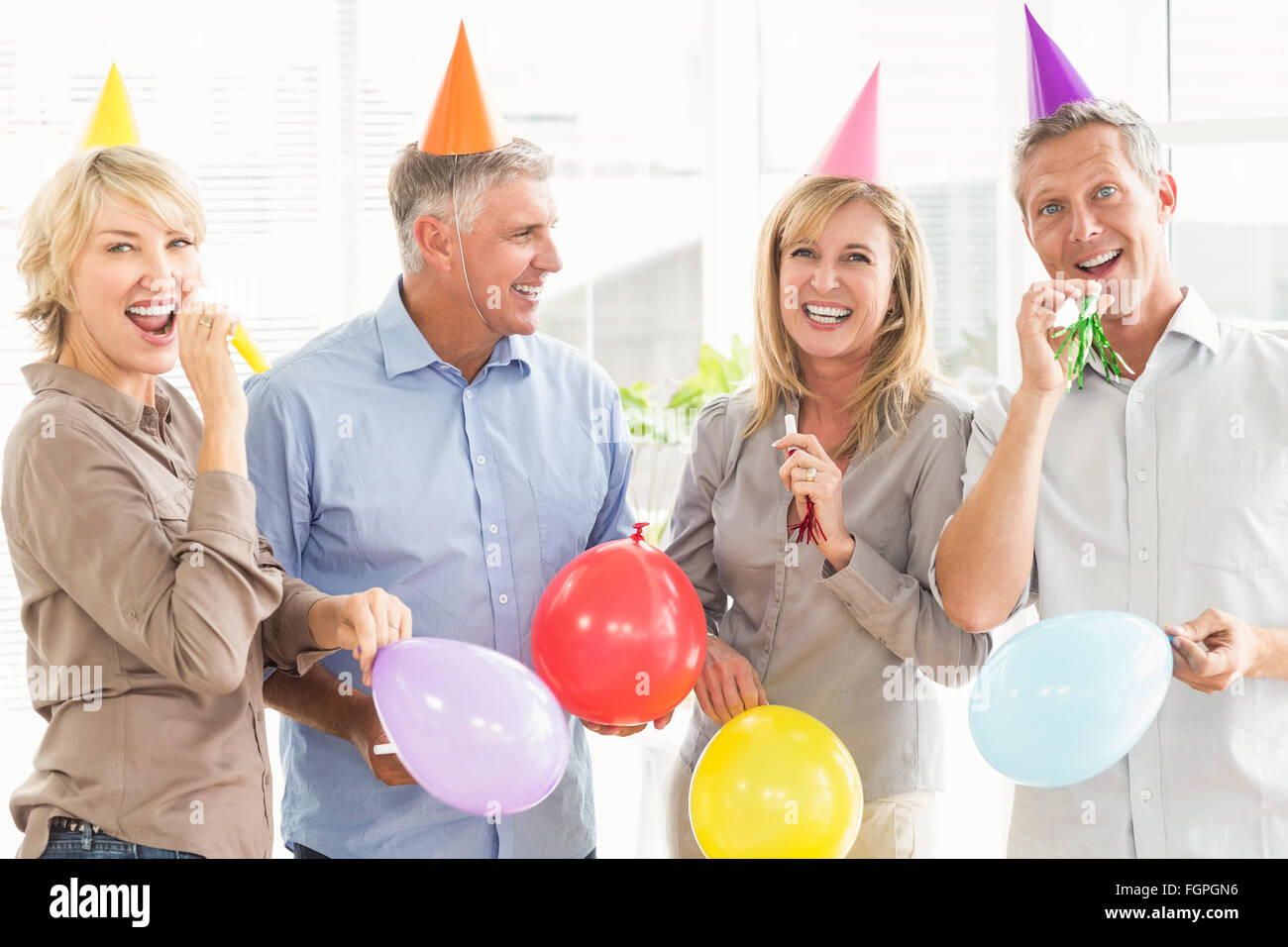 Happy casual business people celebrating birthday Stock Photo - Alamy