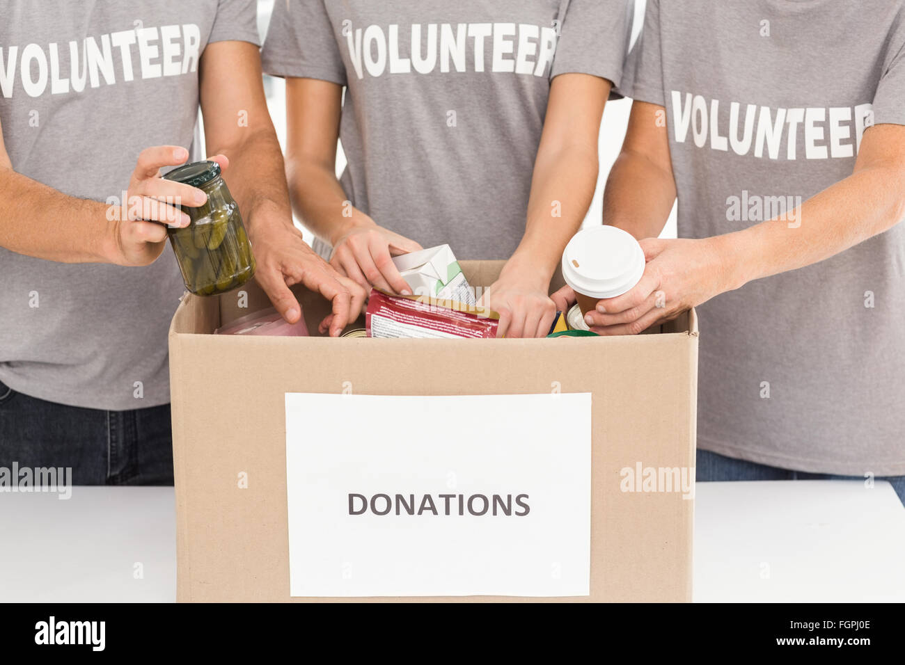 Volunteers sorting donations Stock Photo - Alamy