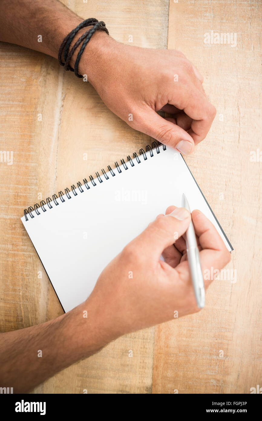 Hands writing on notepad Stock Photo - Alamy
