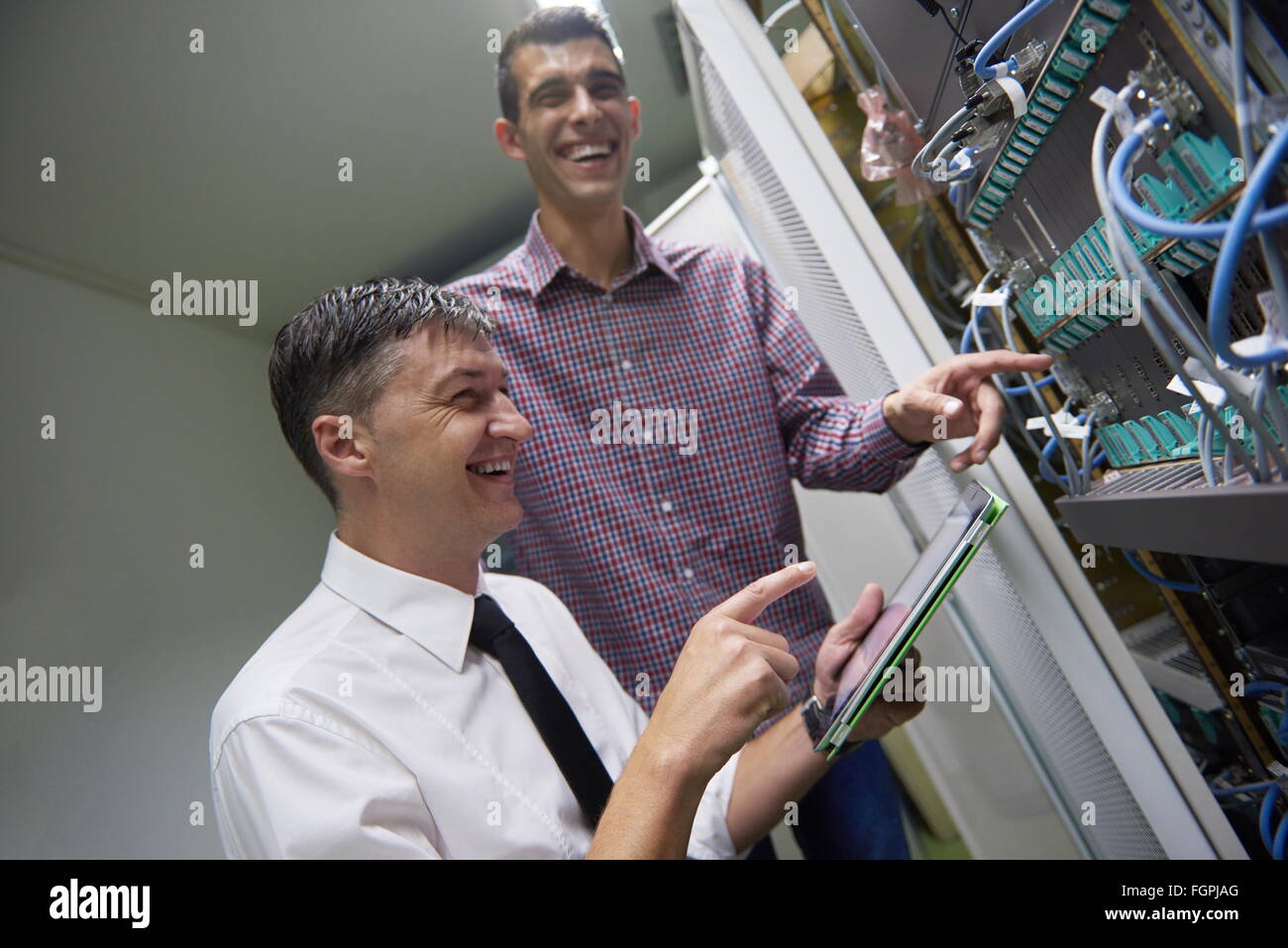 network engineers in server room Stock Photo - Alamy