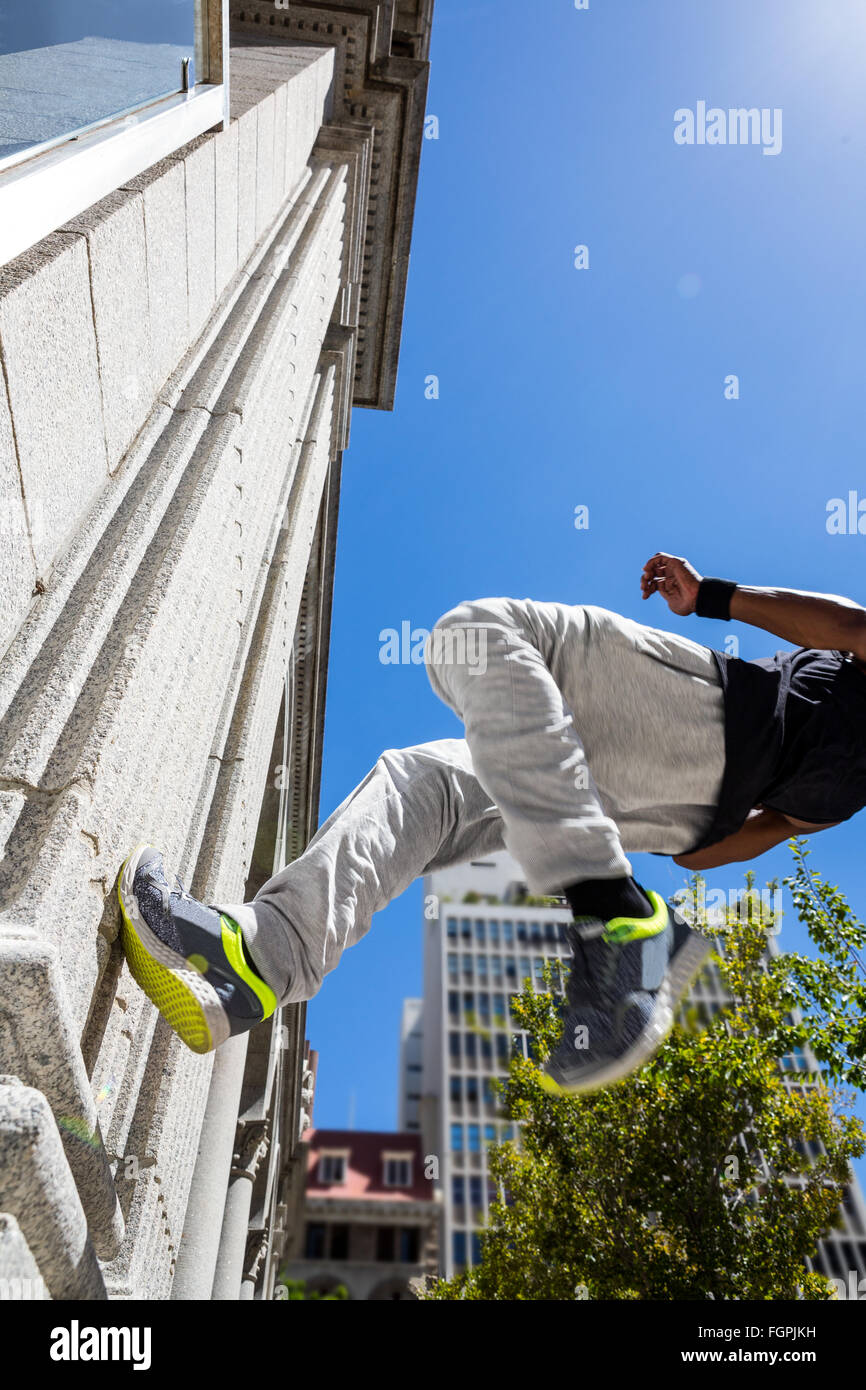 Athlete walking on the wall Stock Photo - Alamy