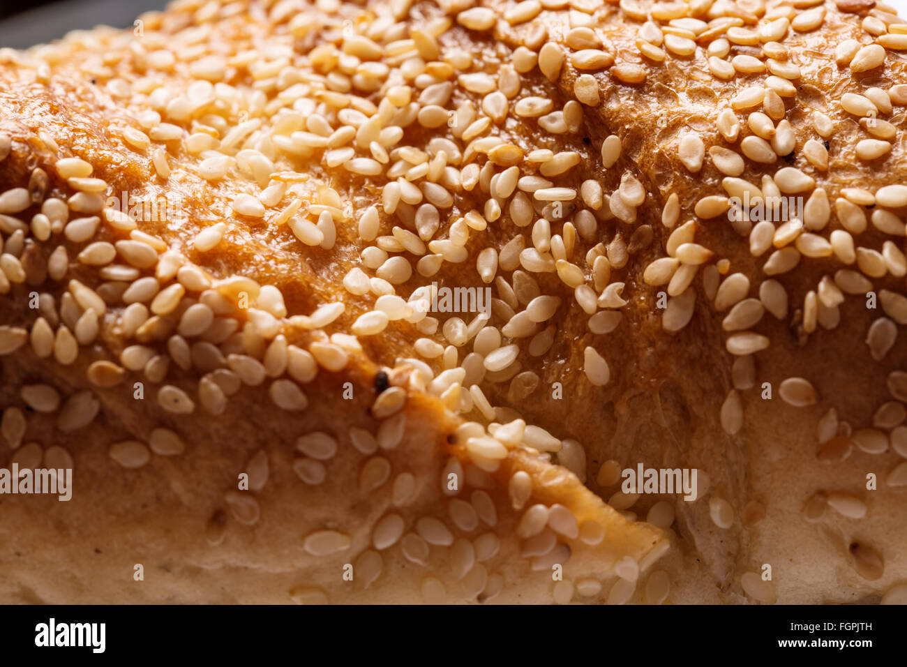 Loaf with sesame seeds background Stock Photo - Alamy