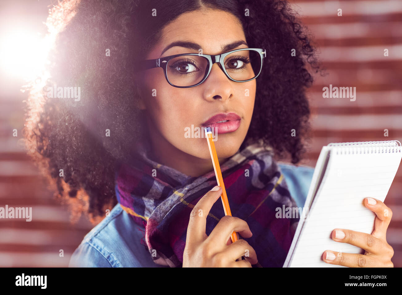 Attractive focused hipster taking notes Stock Photo - Alamy