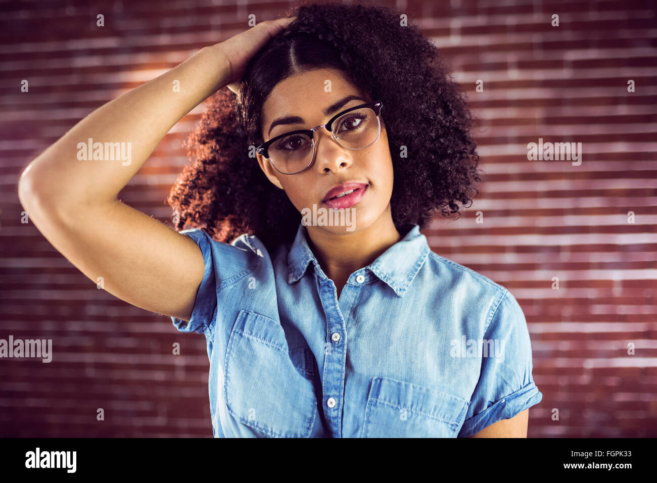 Attractive hipster holding hair back Stock Photo - Alamy