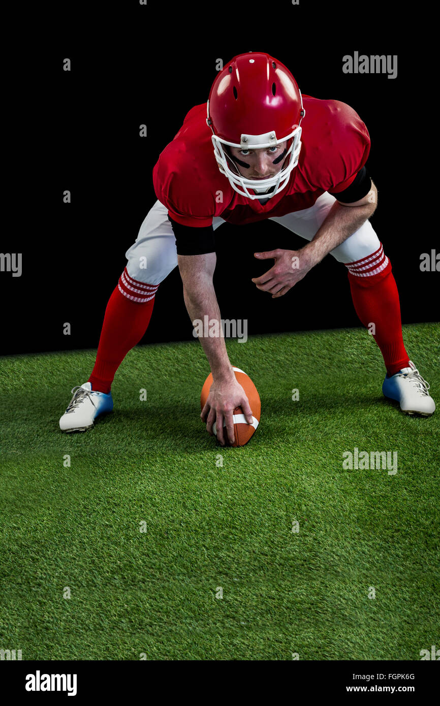 American football player starting football game Stock Photo - Alamy