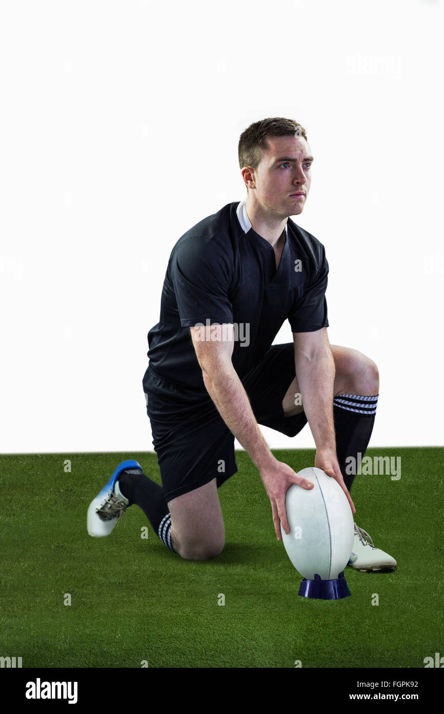 Rugby player ready to make a drop kick Stock Photo - Alamy