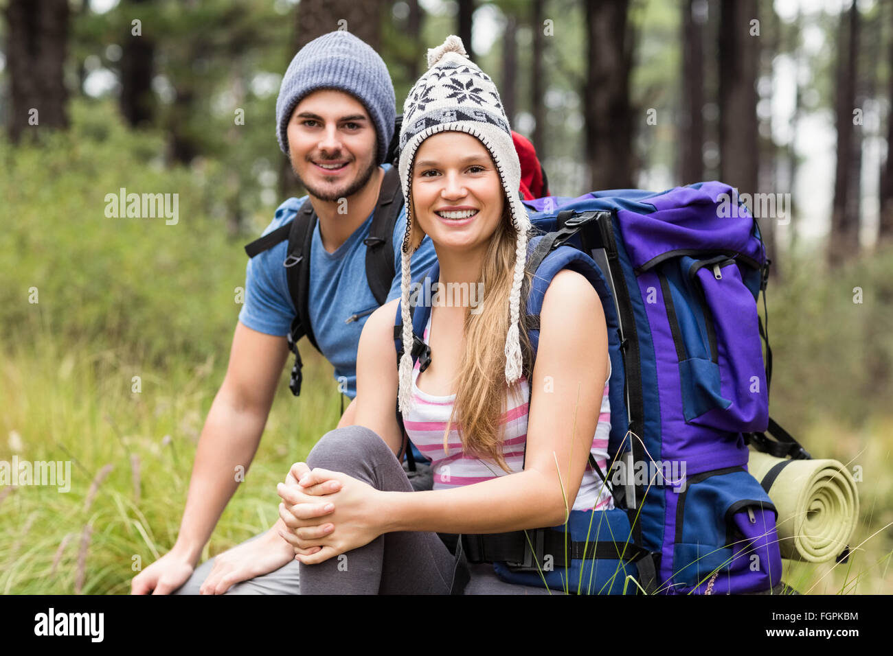 Portrait of a young smiling hiker couple Stock Photo - Alamy