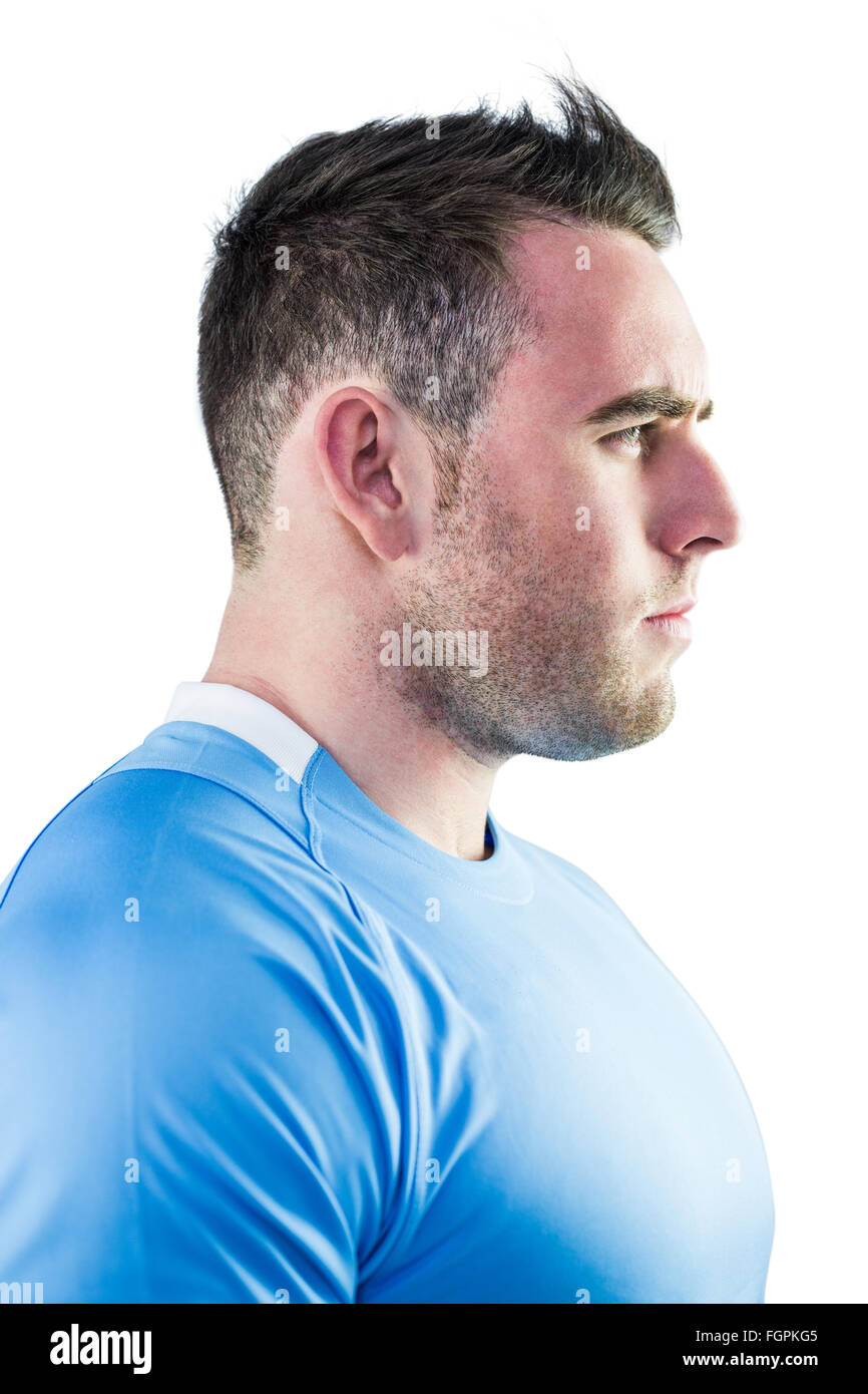 Tough rugby player looking away Stock Photo - Alamy