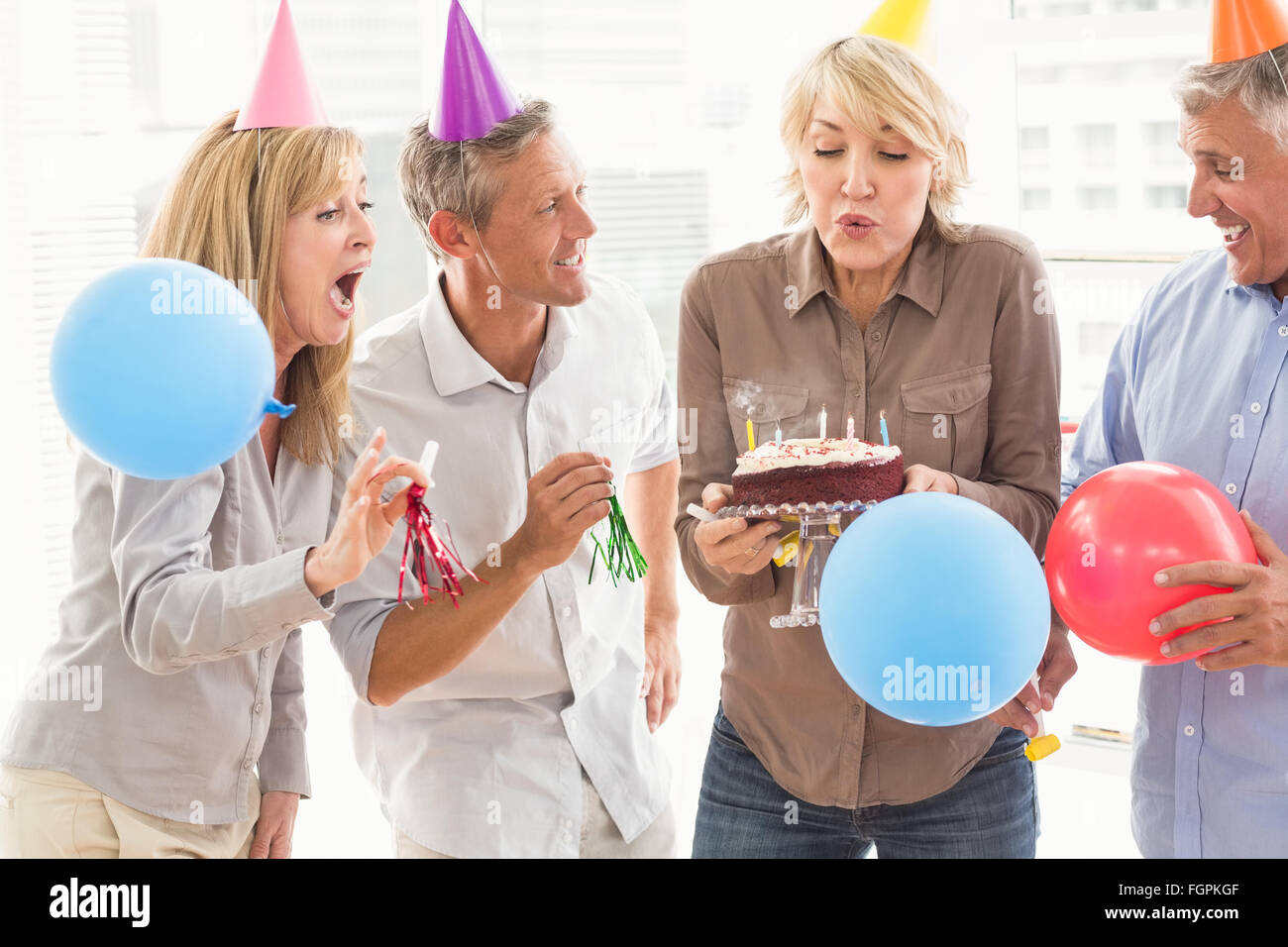 Casual business people celebrating birthday Stock Photo - Alamy