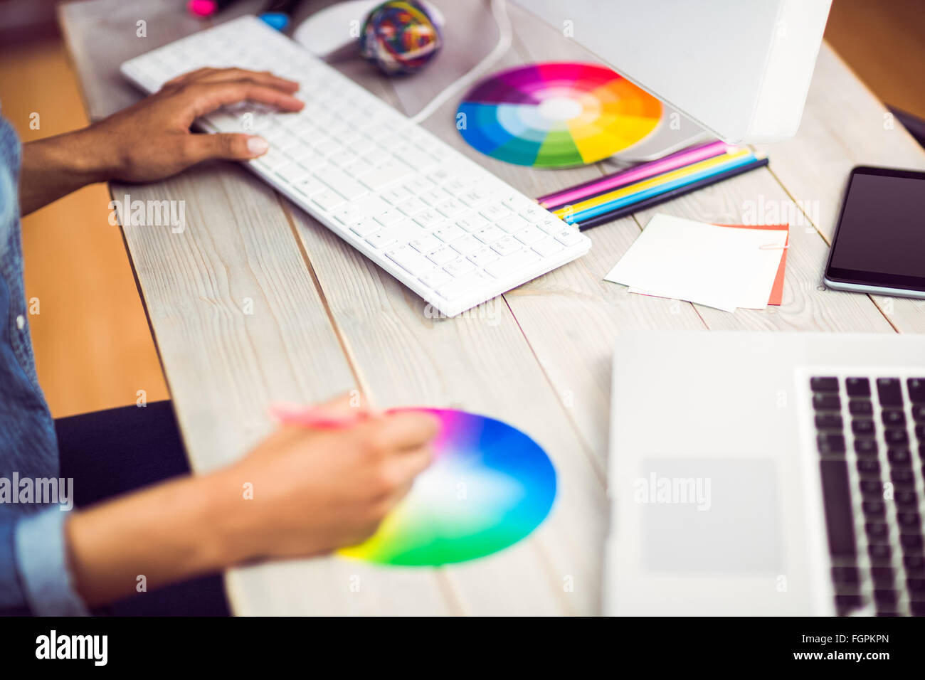Graphic designer working with colour chart Stock Photo - Alamy