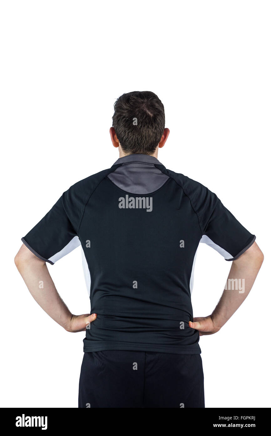 Back turned rugby player with hands on hips Stock Photo - Alamy