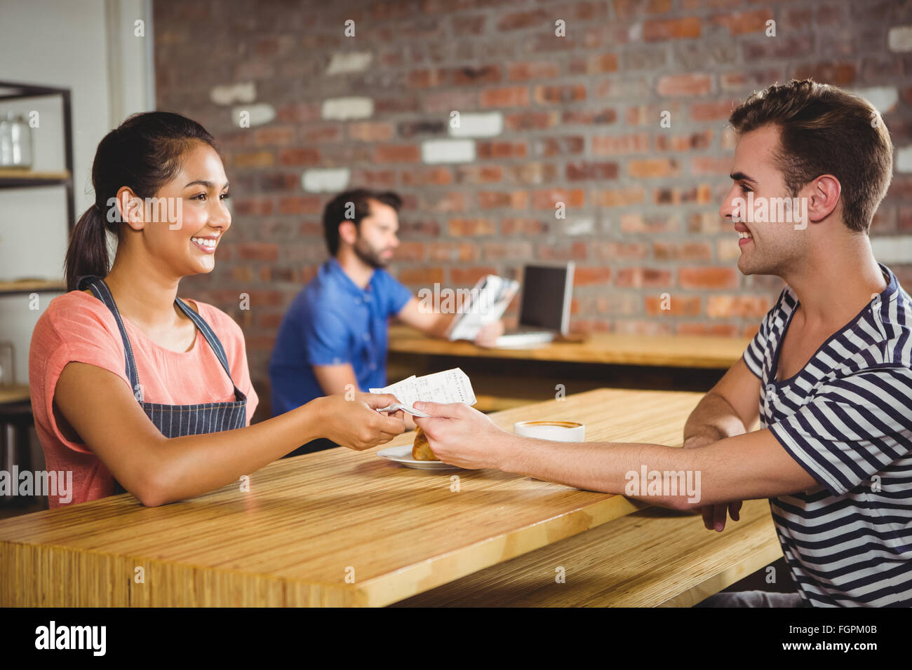 Young man taking his receipt Stock Photo - Alamy