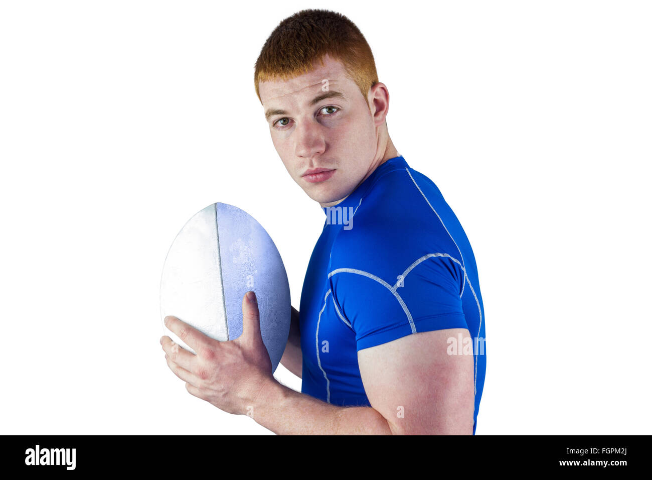 Rugby player holding rugby ball Stock Photo - Alamy